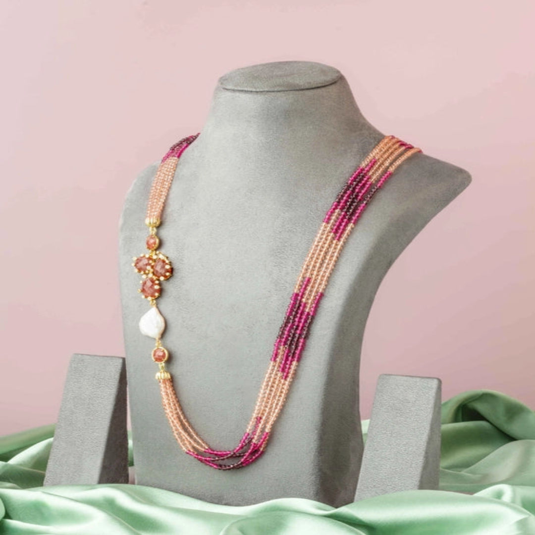 Pretty pink shaded beads strung together with an agate pendant and dia ...